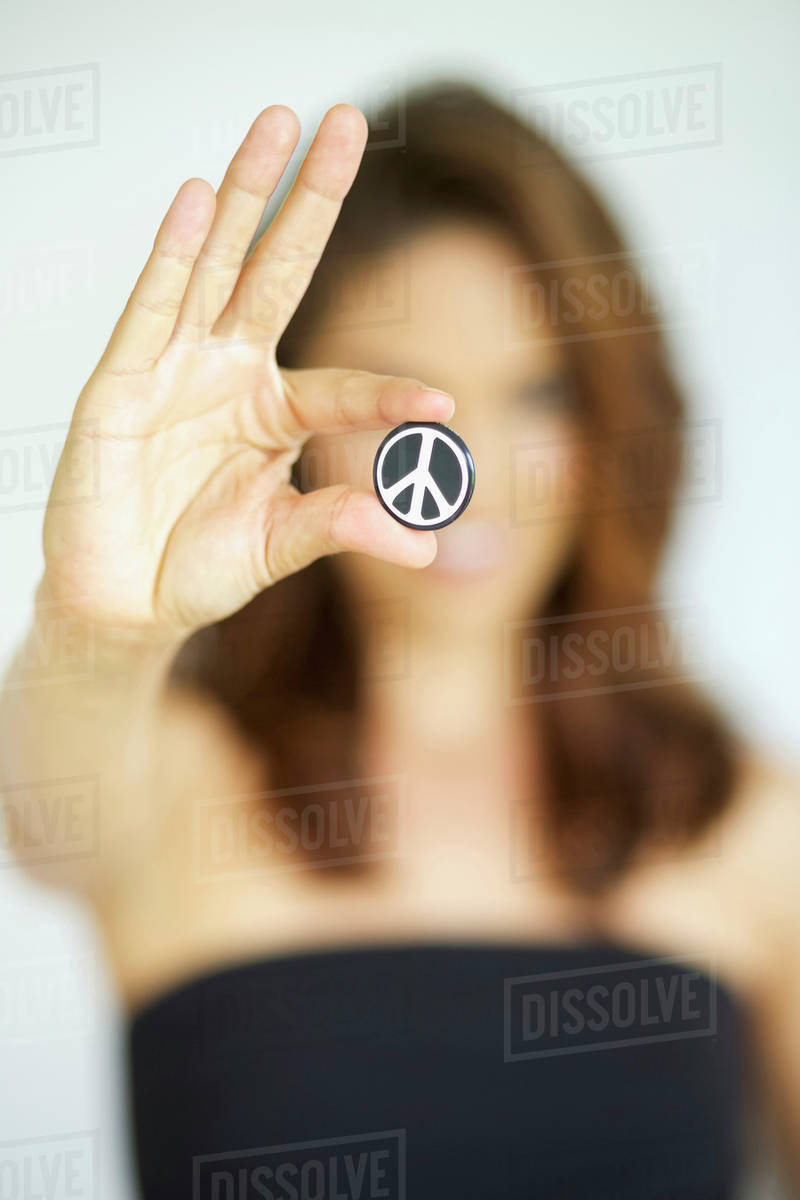 Young woman holding peace symbol; Kauai, Hawaii, United States of ...