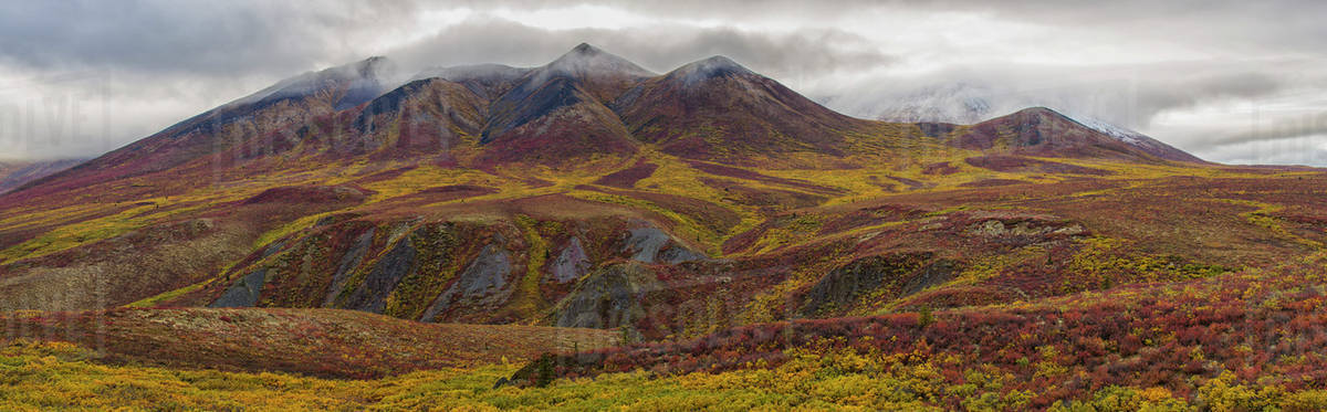 The multi-coloured hills and mountains along the Dempster Highway, near ...