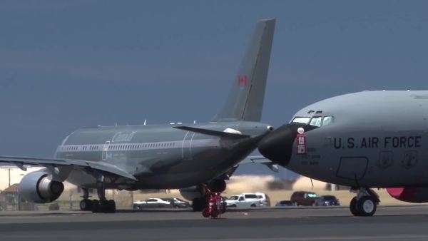 United States Navy F/A-18 Hornets are refueled by a 437 Transportation ...