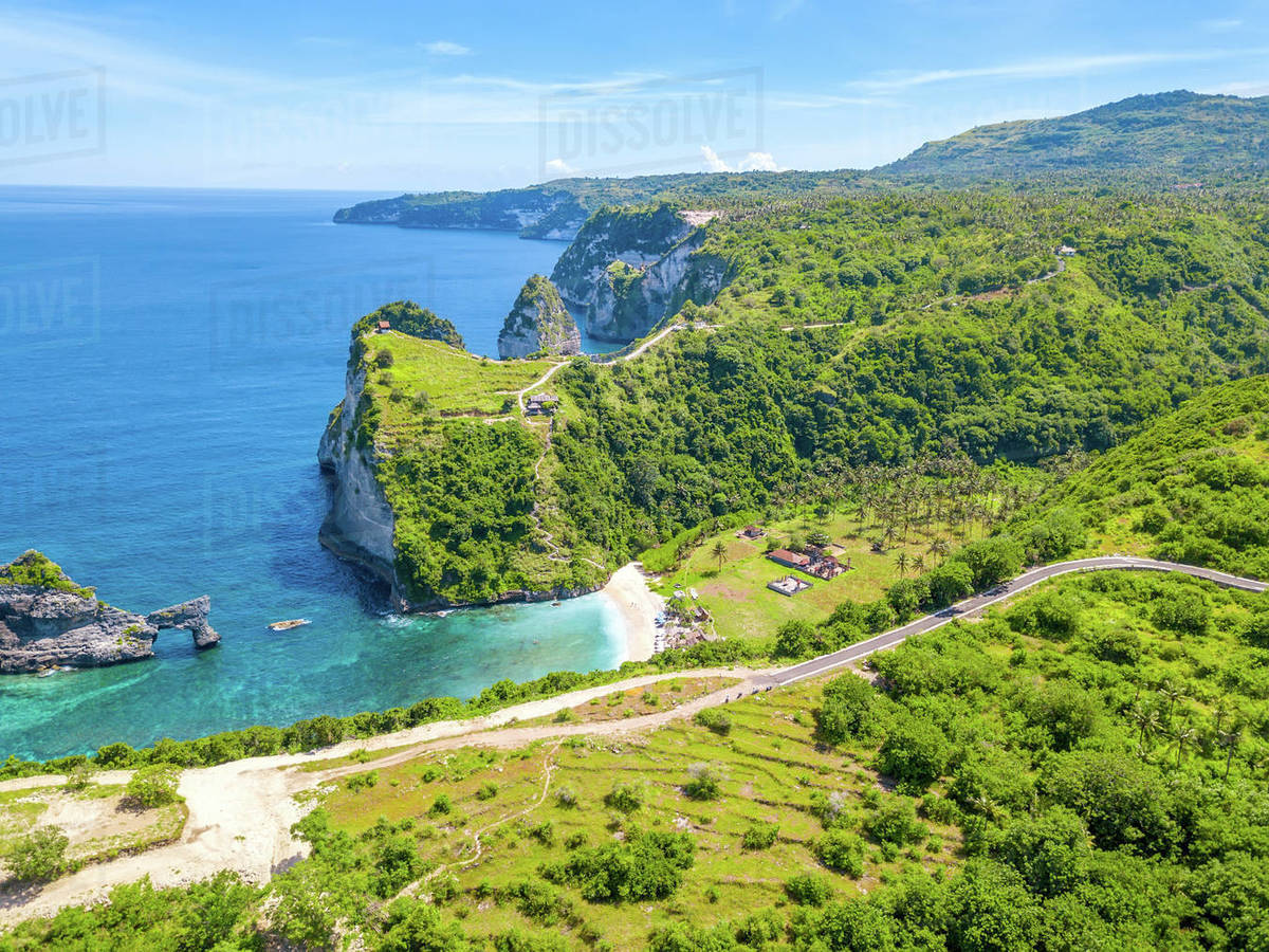 Indonesia. Rocky coast of the tropical island of Penida and a small ...