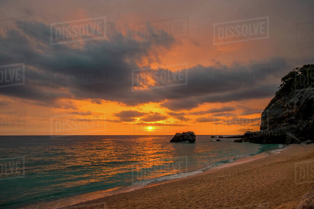 Small beach between the cliffs on the Greek coast of the Mediterranean ...