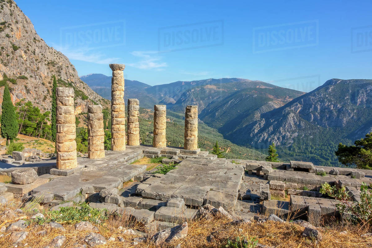 Greece. Delphi. Ancient ruins on a background of sunny mountains ...