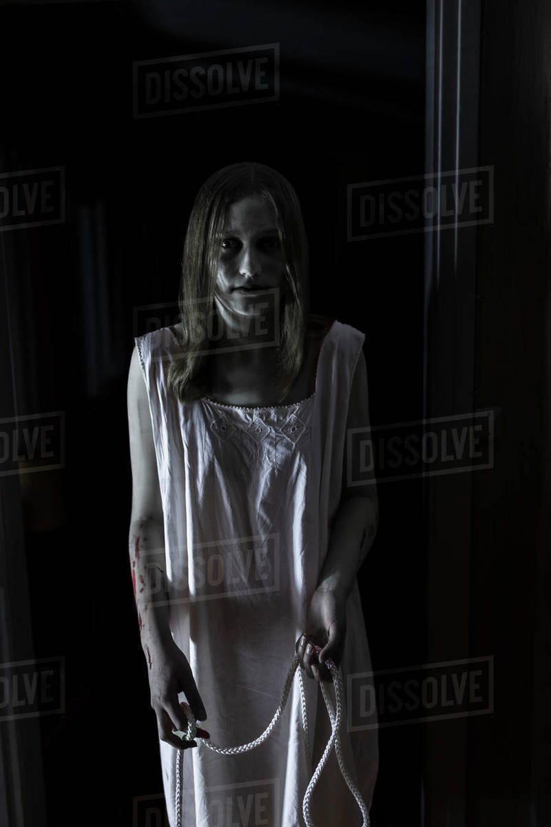 Portrait of spooky ghost holding rope in house - Royalty-free Stock ...