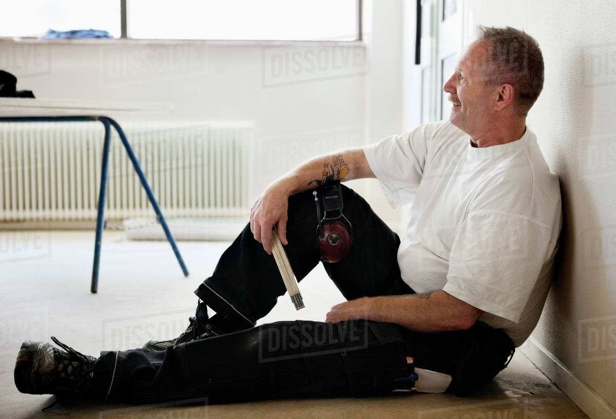Carpenter sitting on floor and relaxing - Royalty-free Stock Photo ...