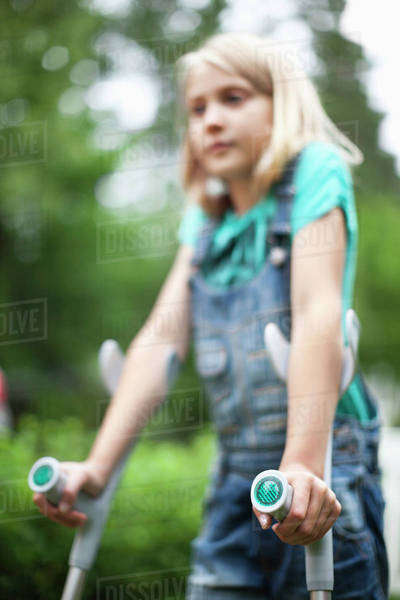 Physically impaired girl with focus on crutches - Royalty-free Stock ...