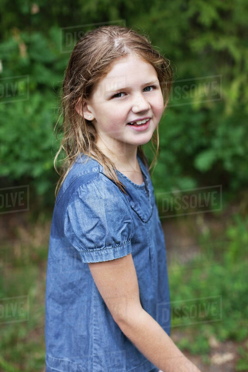 Portrait of smiling pre-adolescent girl with wet hair - Royalty-free ...