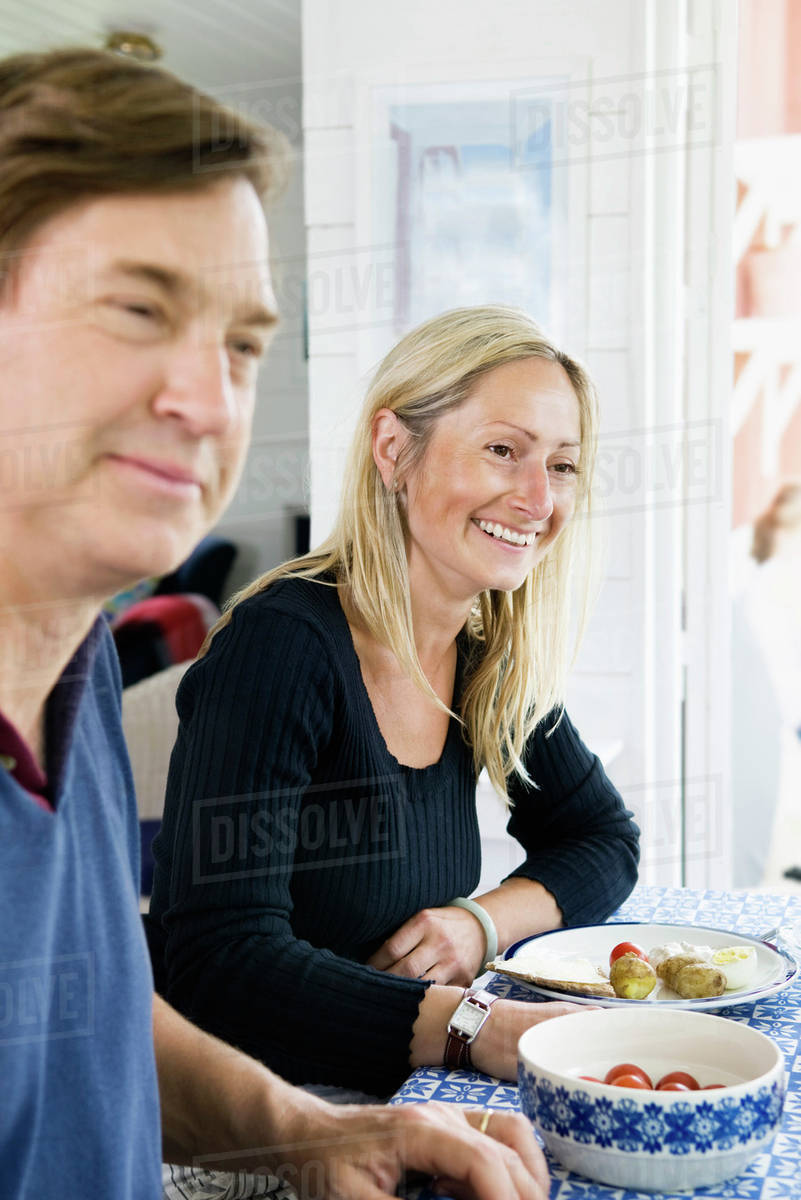 Two people by table - Royalty-free Stock Photo | Dissolve