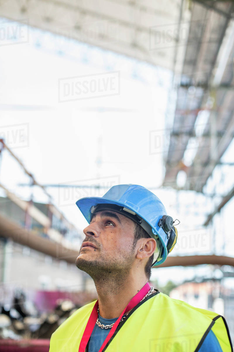 Construction worker looking up at site - Royalty-free Stock Photo ...