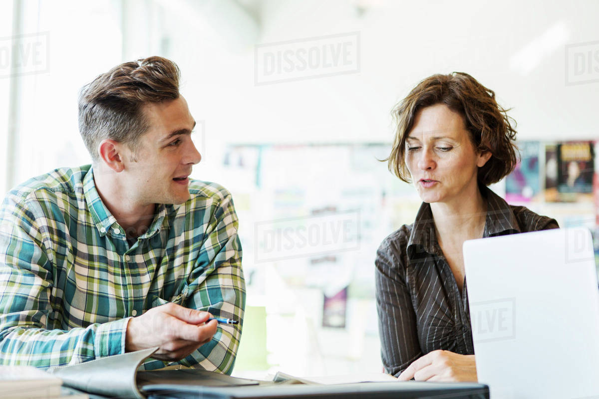 Professor and student talking in classroom - Royalty-free Stock Photo ...
