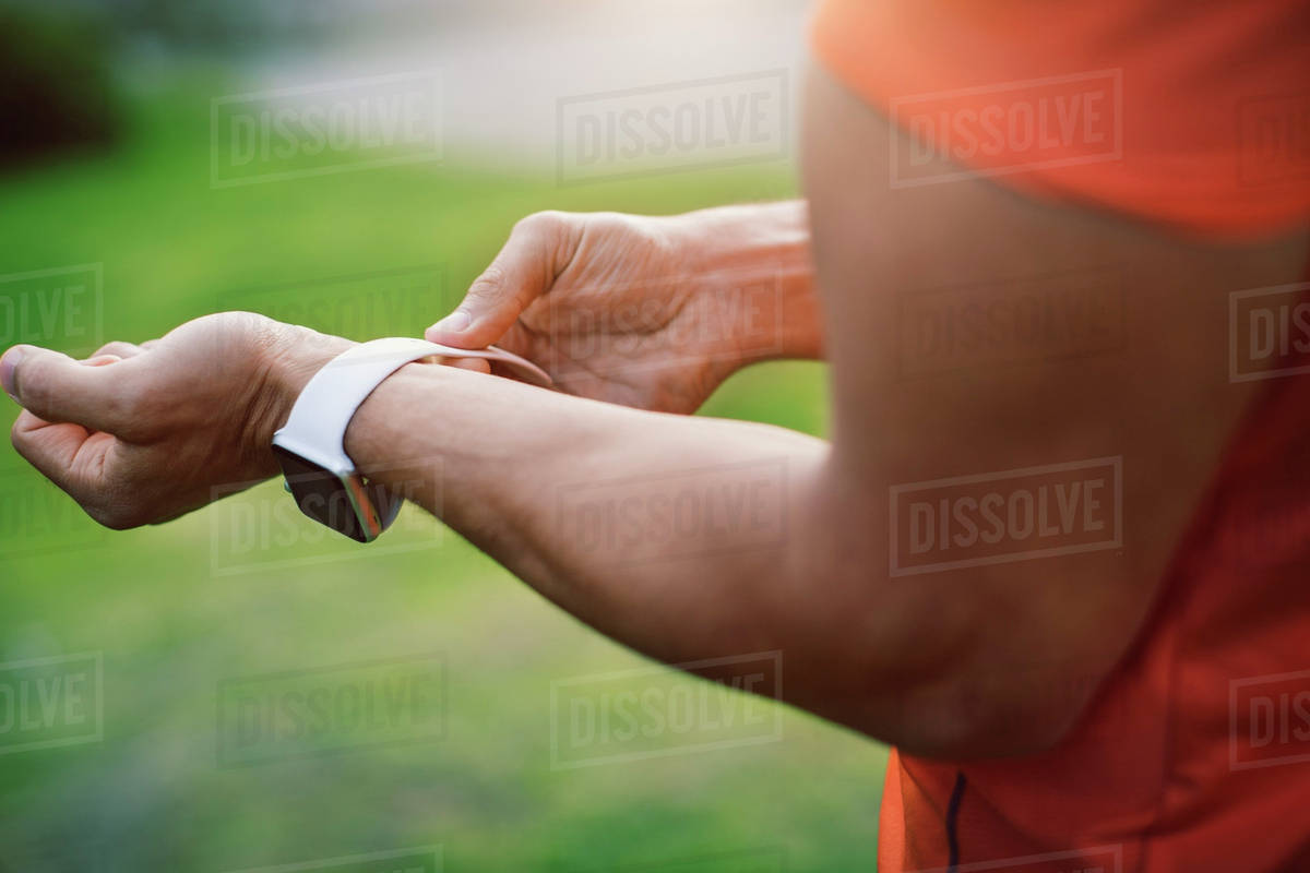 Close-up of man wearing smart watch - Royalty-free Stock Photo | Dissolve