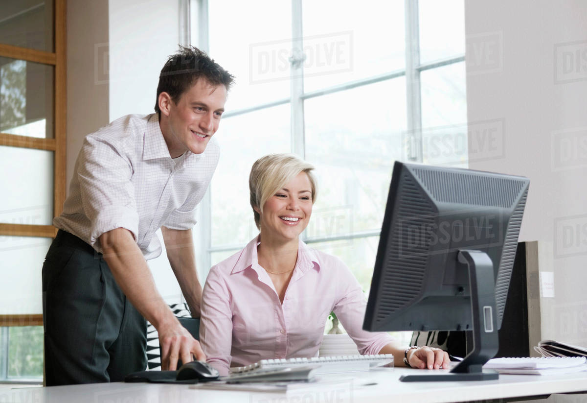 Two people at work - Stock Photo - Dissolve