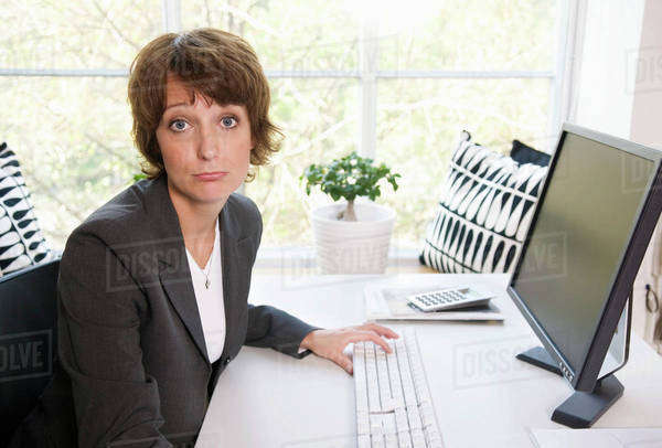 Middle-aged woman at work - Royalty-free Stock Photo | Dissolve