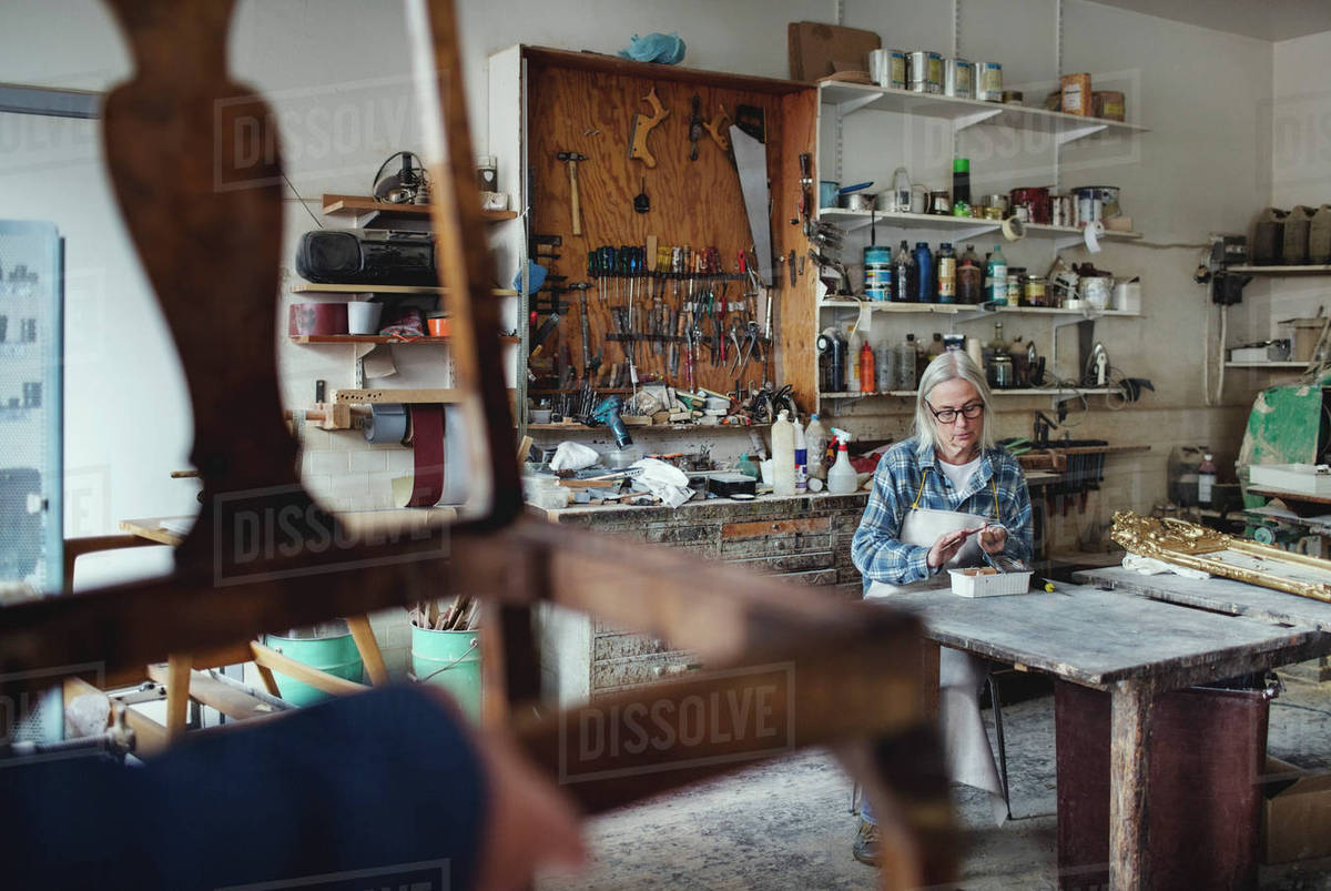Senior craftsperson working at workshop - Royalty-free Stock Photo ...
