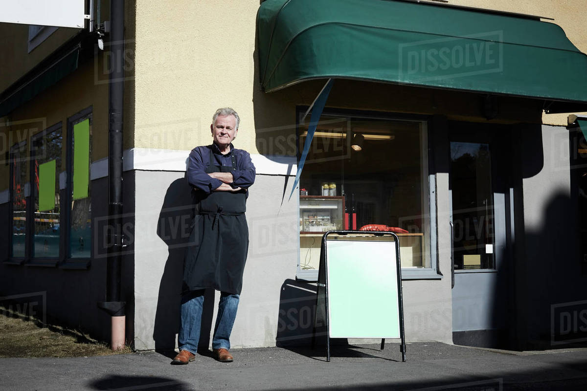 Full length portrait of confident male entrepreneur standing outside ...