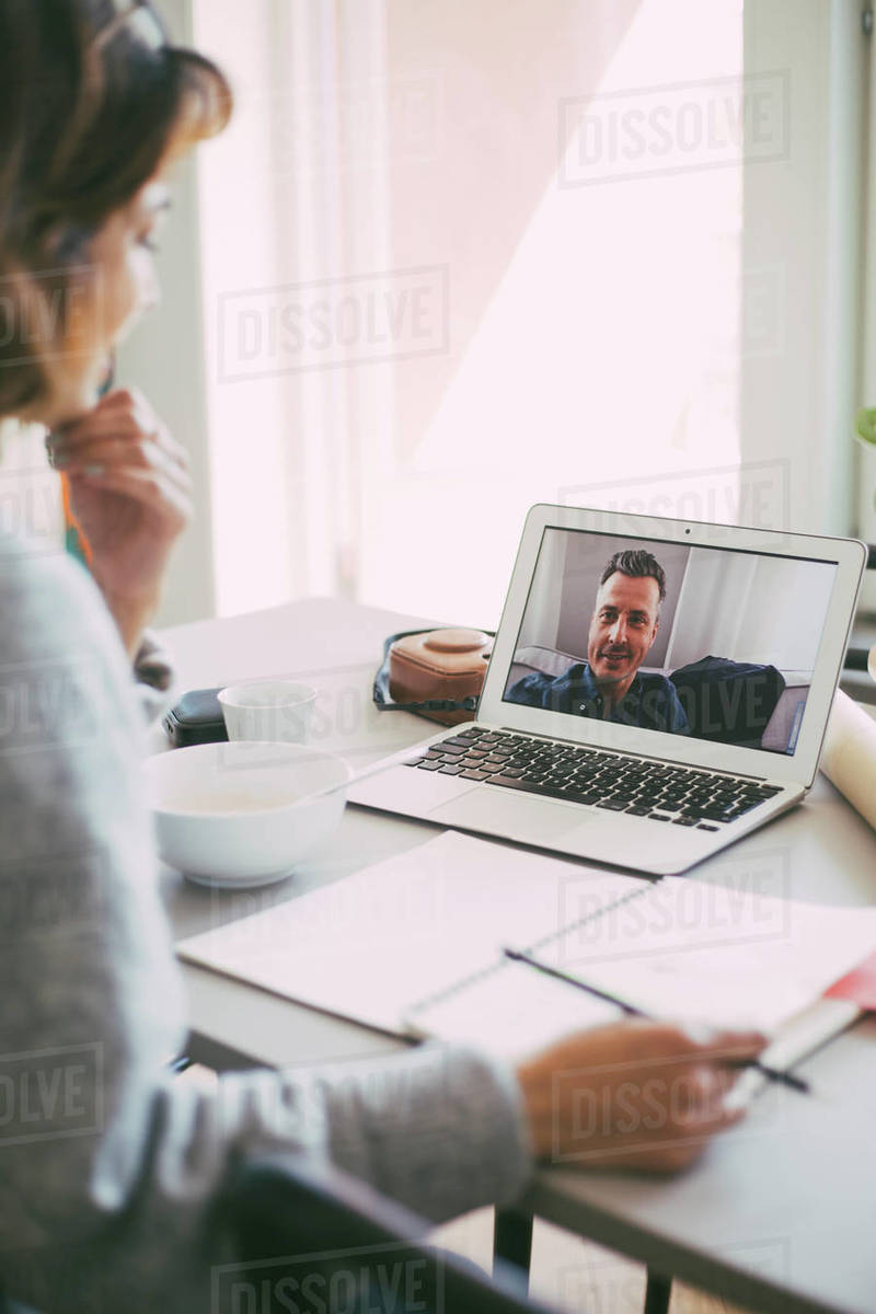 Coworkers having an online meeting at home - Royalty-free Stock Photo ...