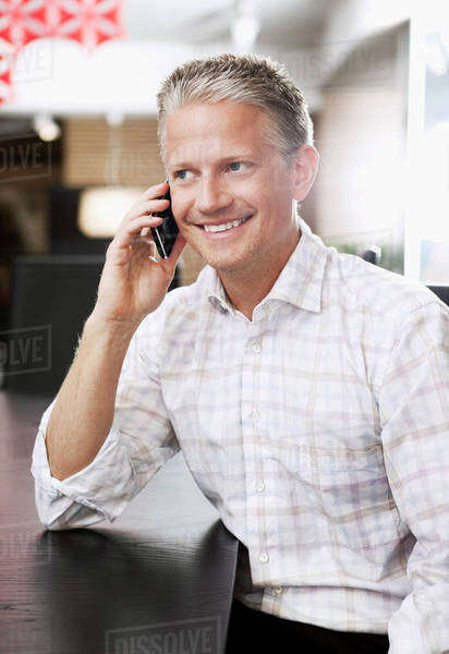 Happy man talking on the phone - Royalty-free Stock Photo | Dissolve