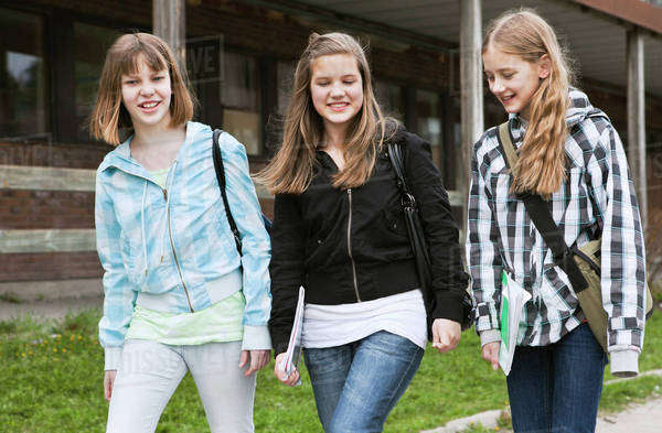 Three girls walking - Royalty-free Stock Photo | Dissolve