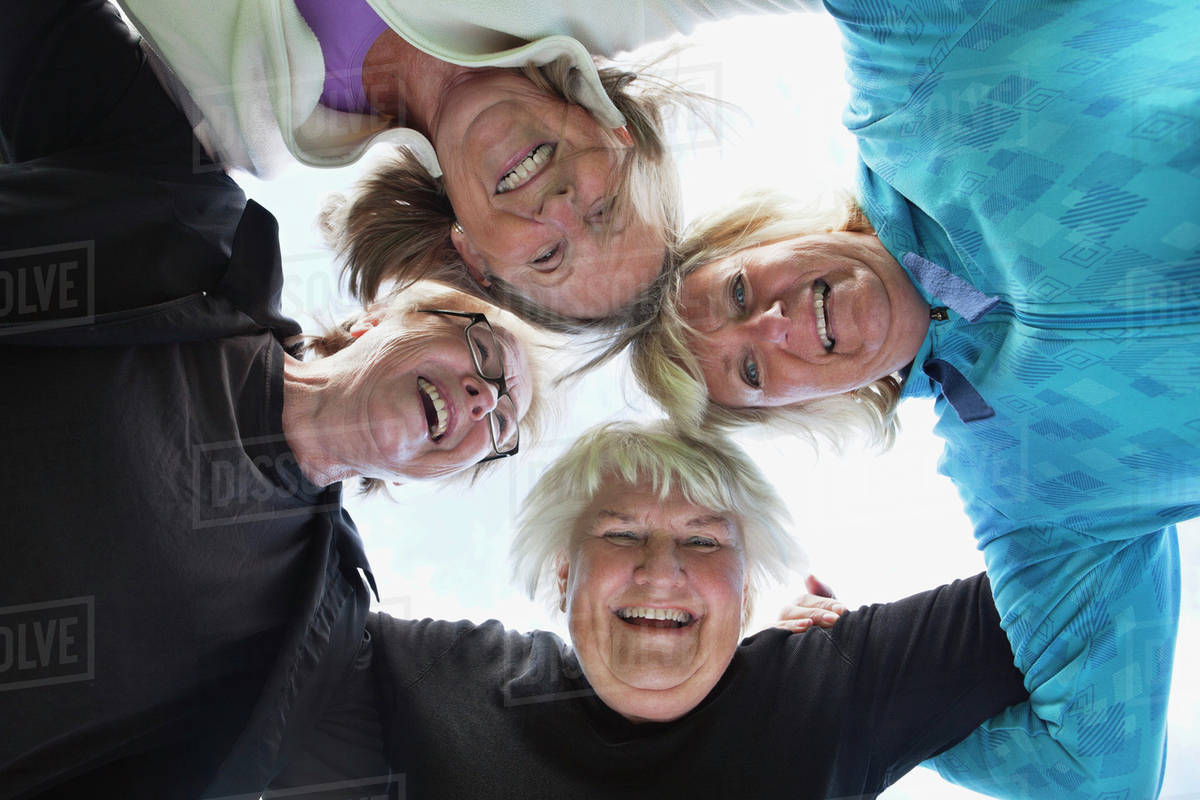 Four friends in a circle - Stock Photo - Dissolve
