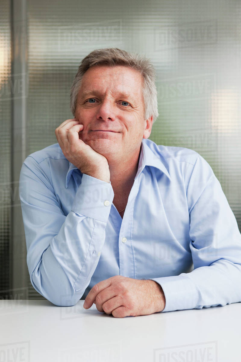 Man leaning against hand - Royalty-free Stock Photo | Dissolve