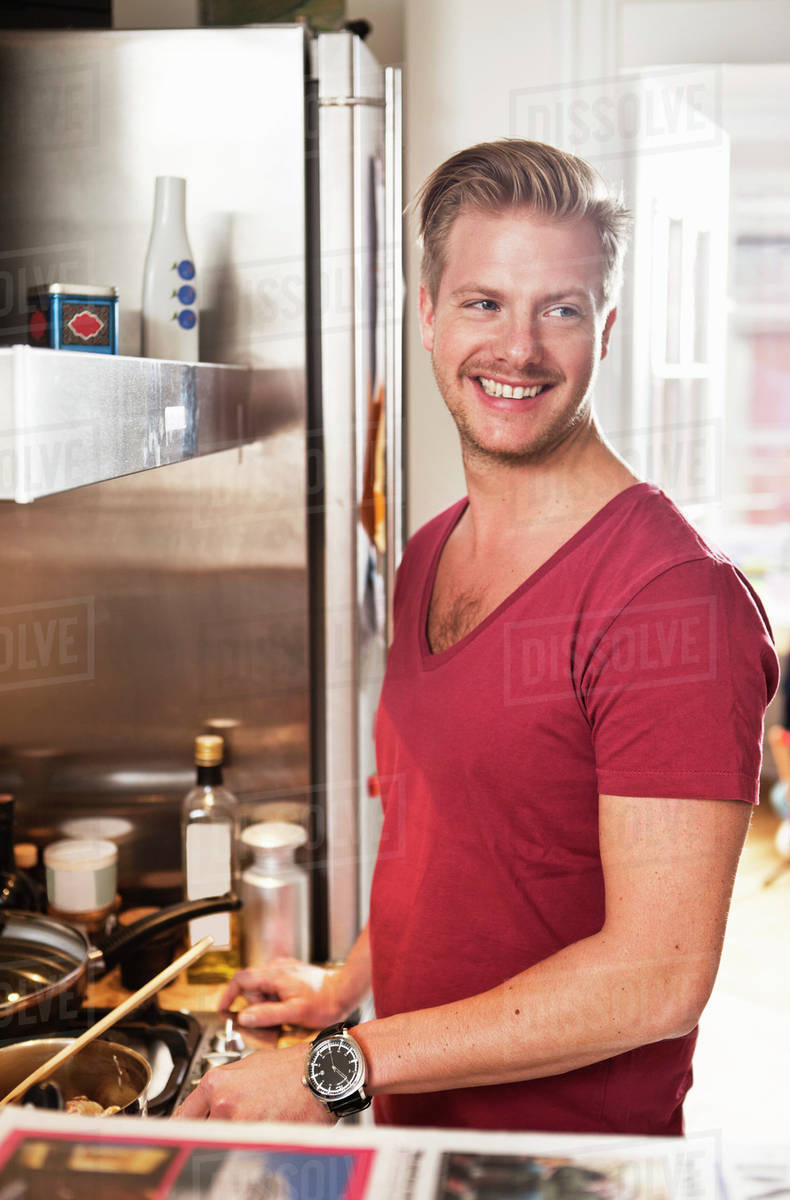 Guy cooking - Royalty-free Stock Photo | Dissolve