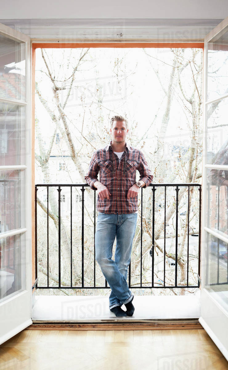 Guy on balcony - Stock Photo - Dissolve