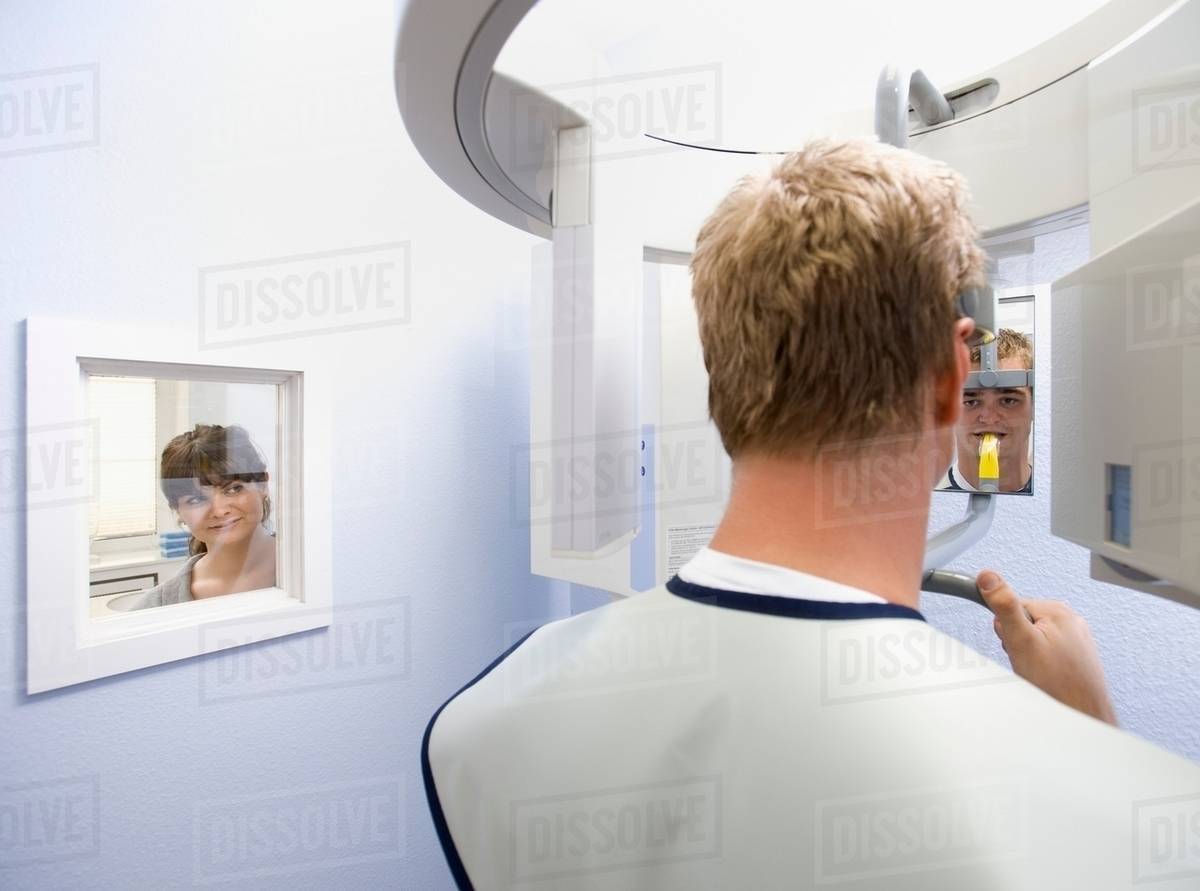 Dental patient having x-ray taken - Stock Photo - Dissolve