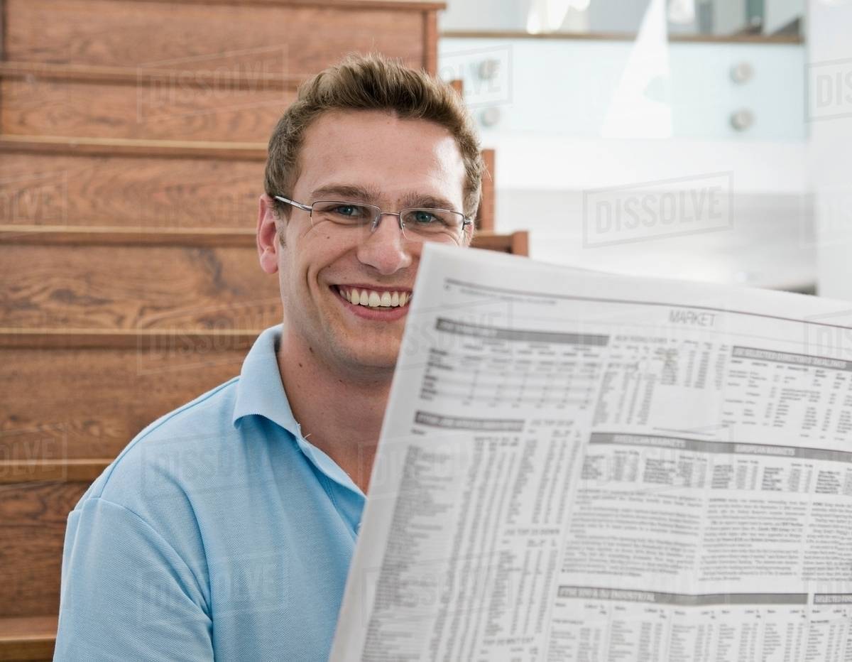 Male reading the paper. - Royalty-free Stock Photo | Dissolve