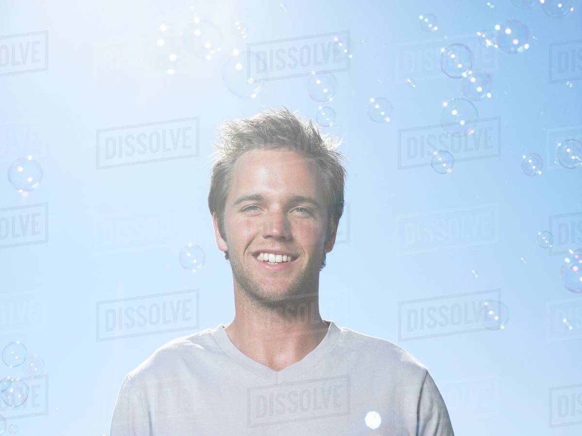 Man in sun with bubbles - Royalty-free Stock Photo | Dissolve