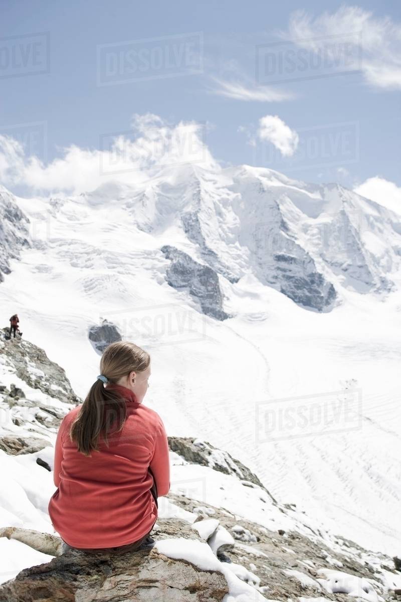 Girl looking at mountain scenery - Royalty-free Stock Photo | Dissolve