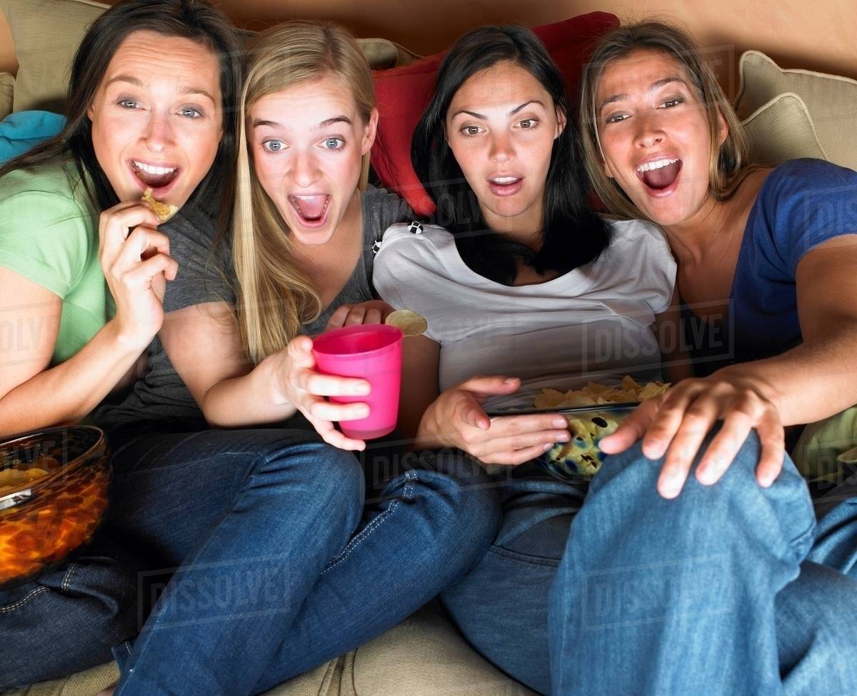 Women watching television - Stock Photo - Dissolve