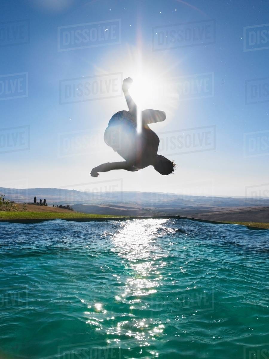 Man jumping in swimming pool - Royalty-free Stock Photo | Dissolve