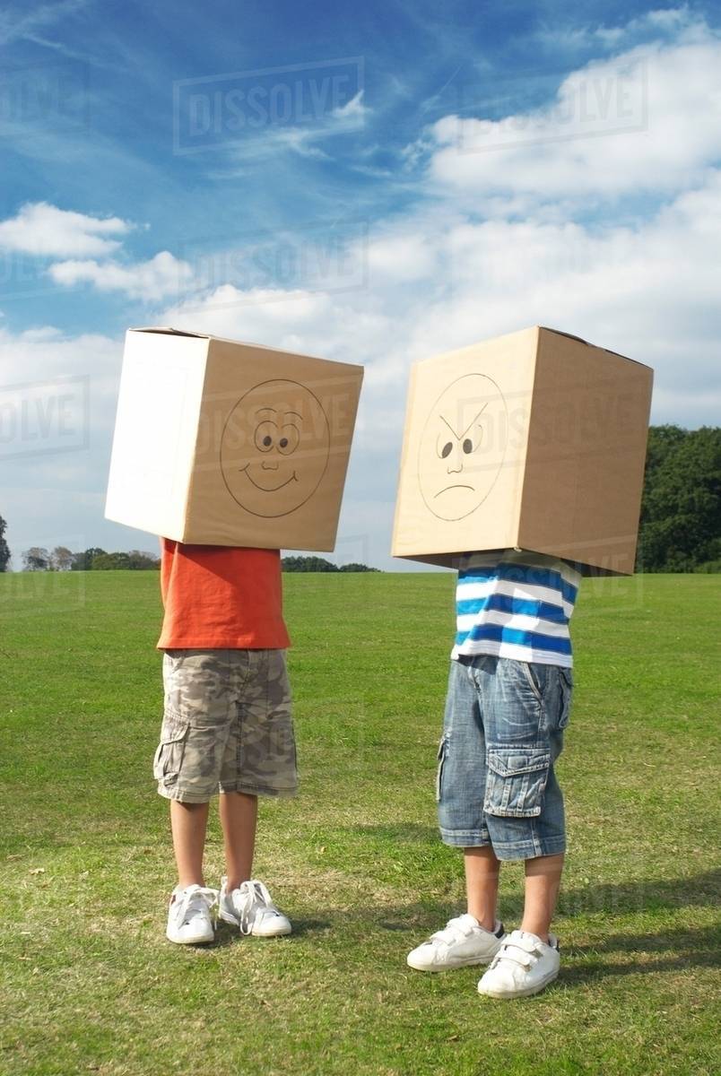 Boys with boxes over heads - Royalty-free Stock Photo | Dissolve