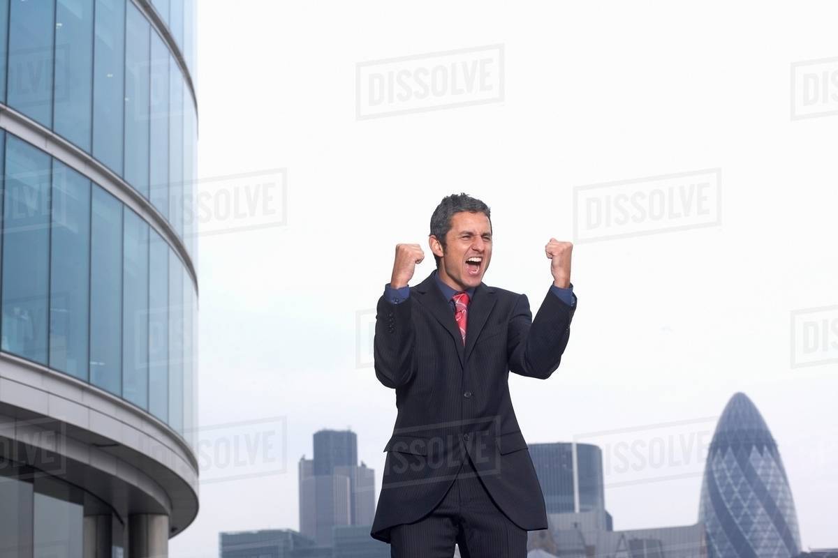 Business man celebrating - Royalty-free Stock Photo | Dissolve