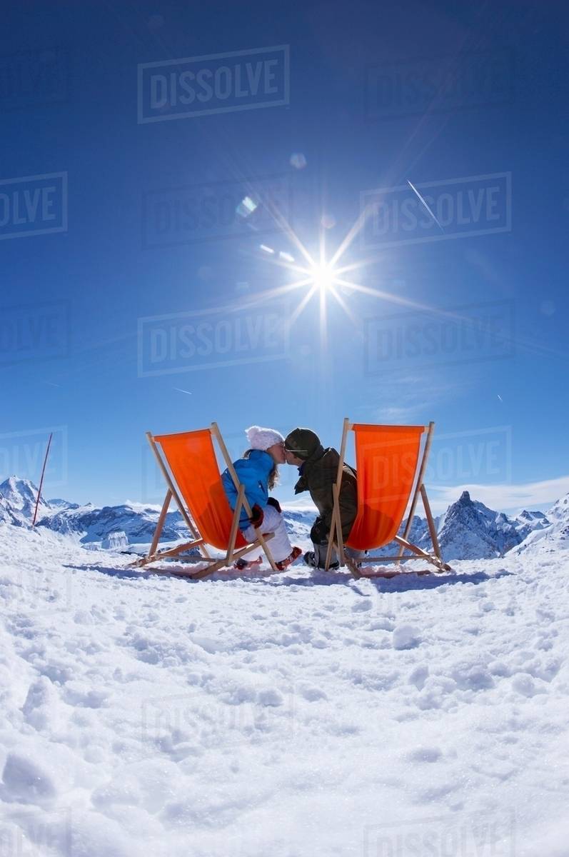 Couple kissing/reclining in deck chairs - Royalty-free Stock Photo ...
