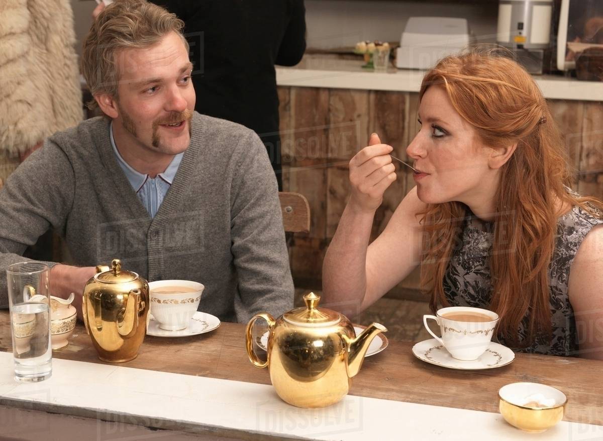 Couple having tea in cafÃ© - Royalty-free Stock Photo | Dissolve