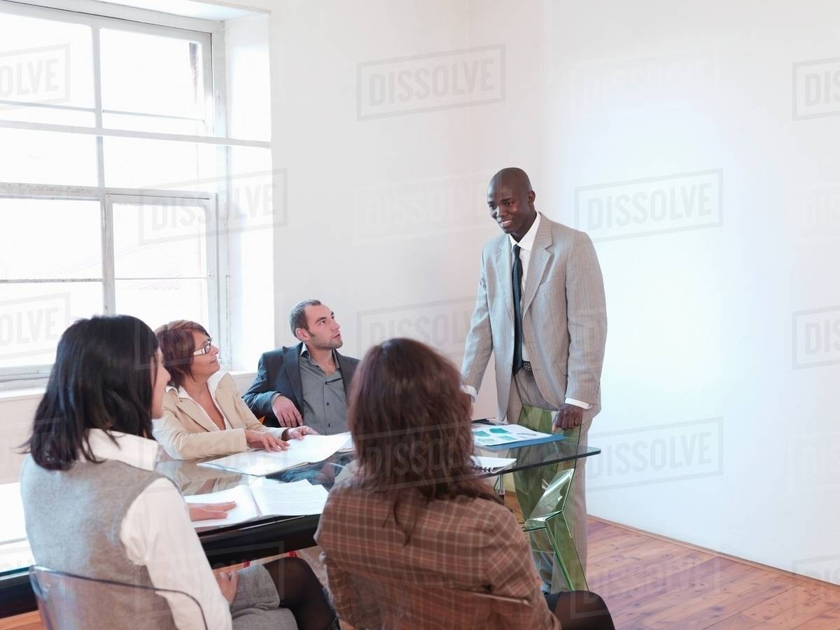 Businessman giving presentation - Stock Photo - Dissolve