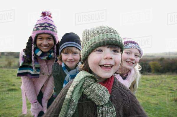Children playing in field - Royalty-free Stock Photo | Dissolve
