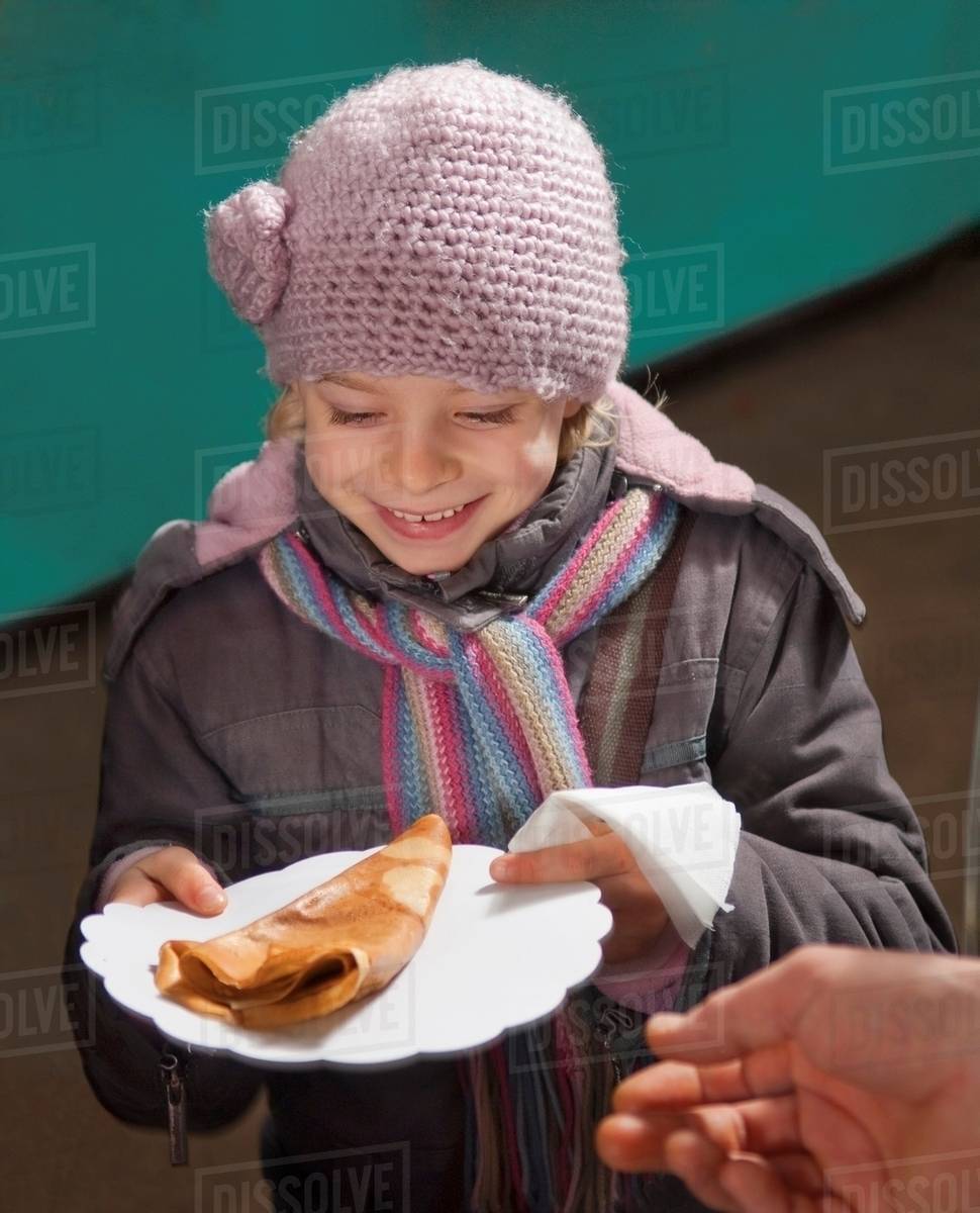 Girl happy with crepe - Royalty-free Stock Photo | Dissolve