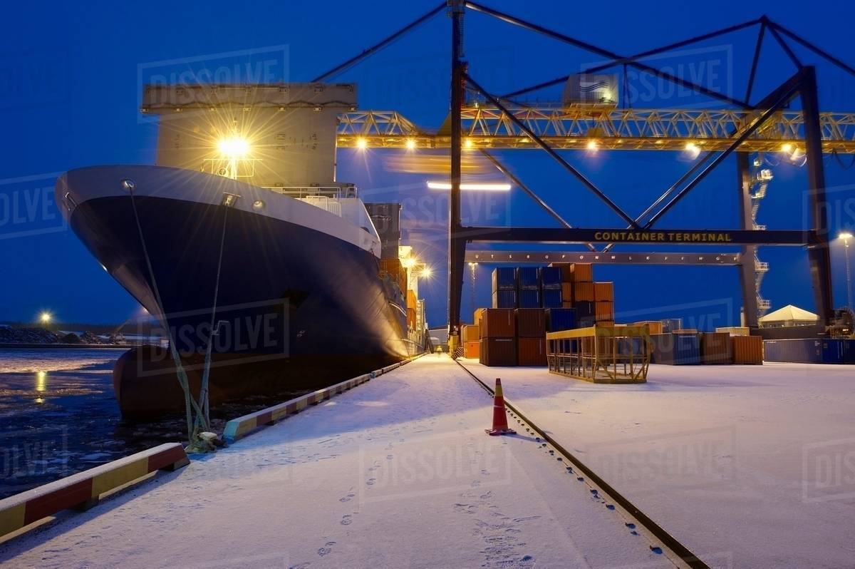 Ship docked in container harbour - Royalty-free Stock Photo | Dissolve