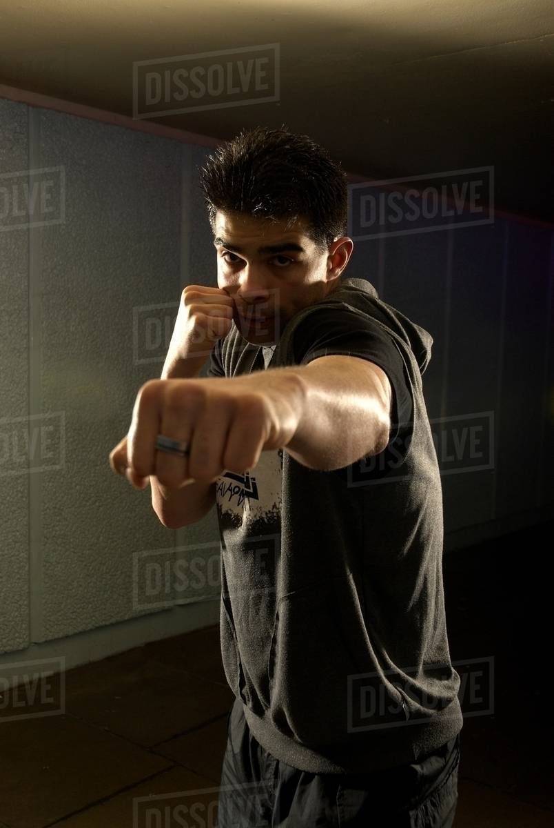 Man throwing punch - Royalty-free Stock Photo | Dissolve