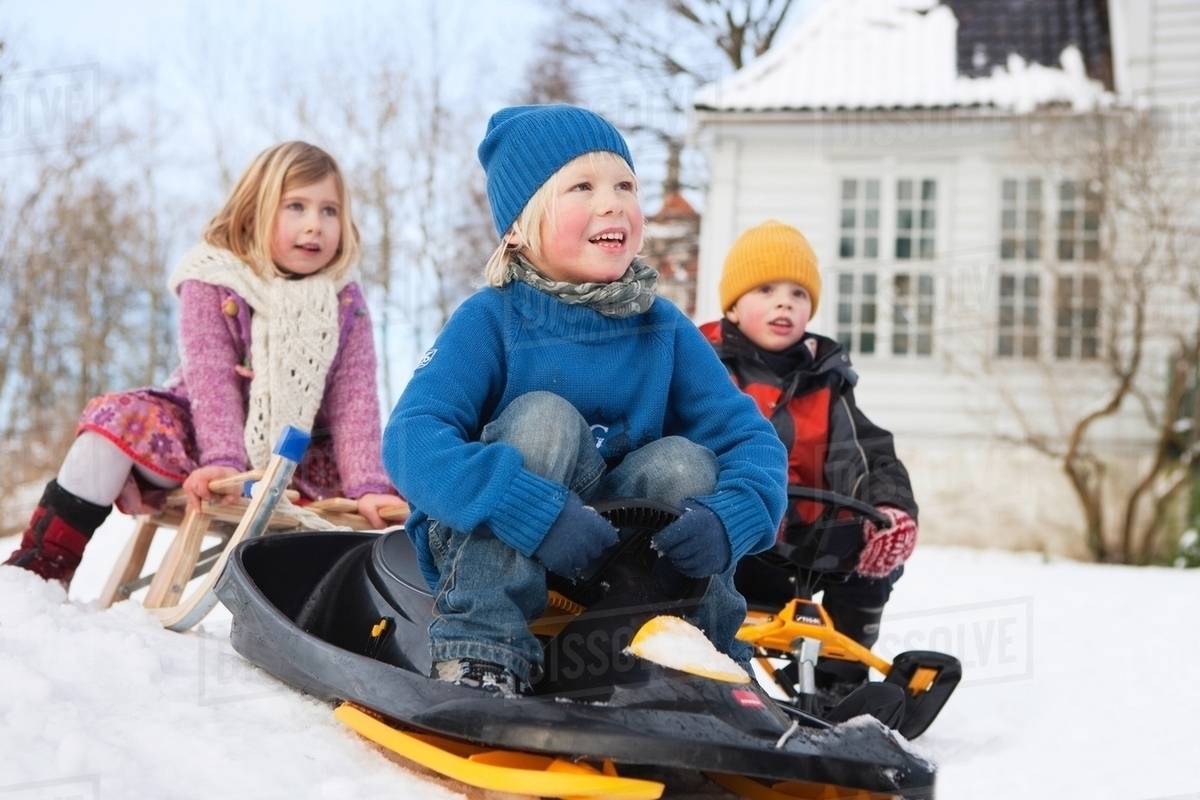 Scandinavian children on sleds - Royalty-free Stock Photo | Dissolve