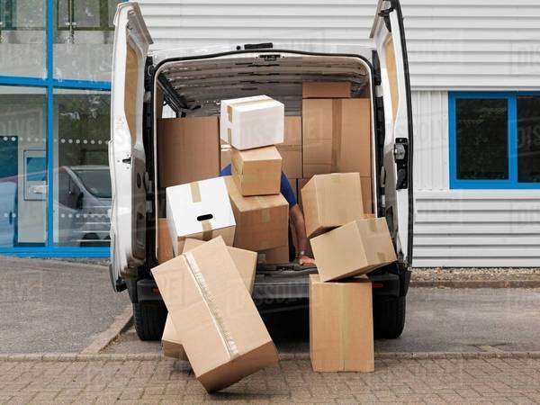Boxes falling from back of van - Royalty-free Stock Photo | Dissolve