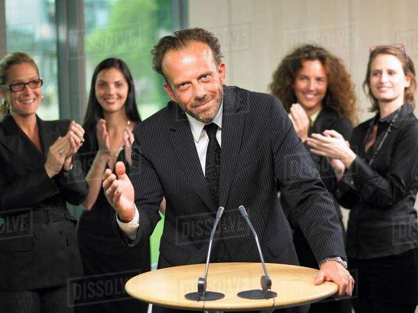 Business man giving a conference - Stock Photo - Dissolve