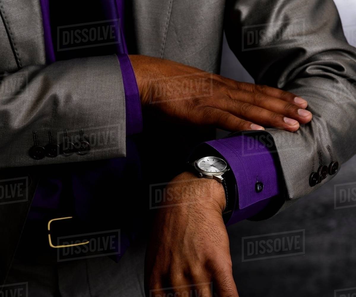 Business man looking at watch - Royalty-free Stock Photo | Dissolve
