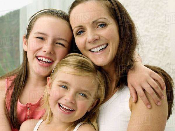 A portrait of a mother and two daughters - Royalty-free Stock Photo ...