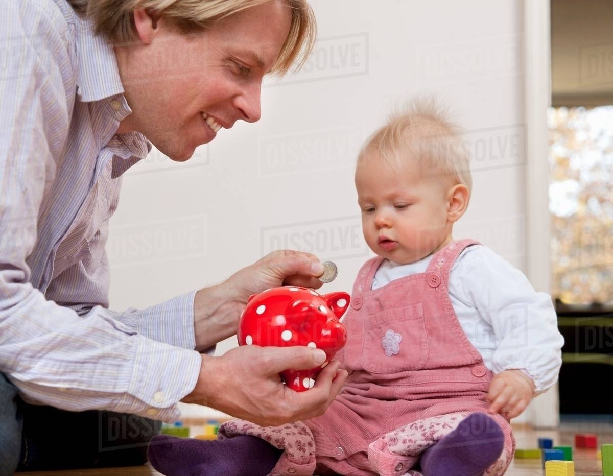 Father saving for baby - Stock Photo - Dissolve