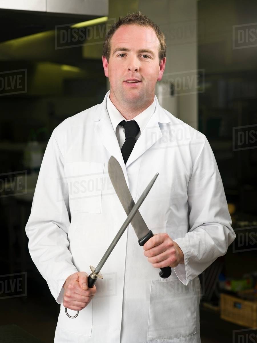 A butcher sharpening his knife - Royalty-free Stock Photo | Dissolve