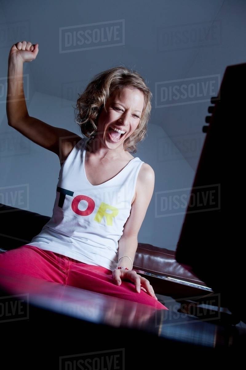 Woman cheering - Royalty-free Stock Photo | Dissolve