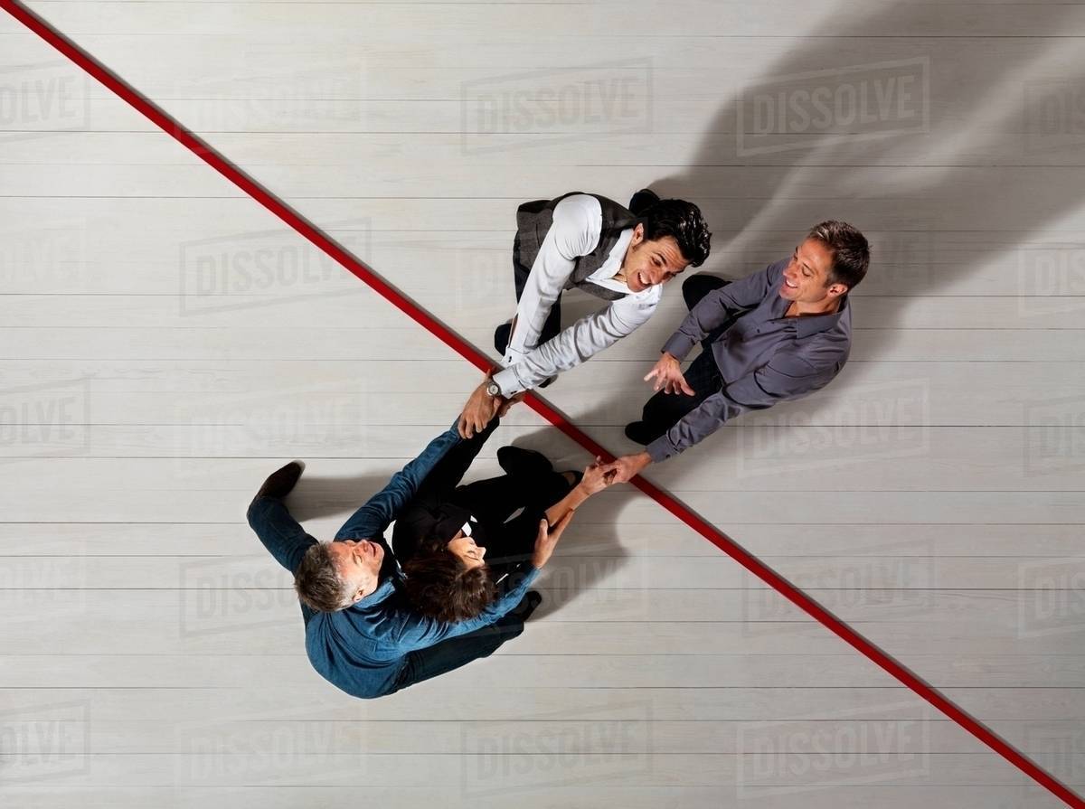 Business people pulling each other - Royalty-free Stock Photo | Dissolve
