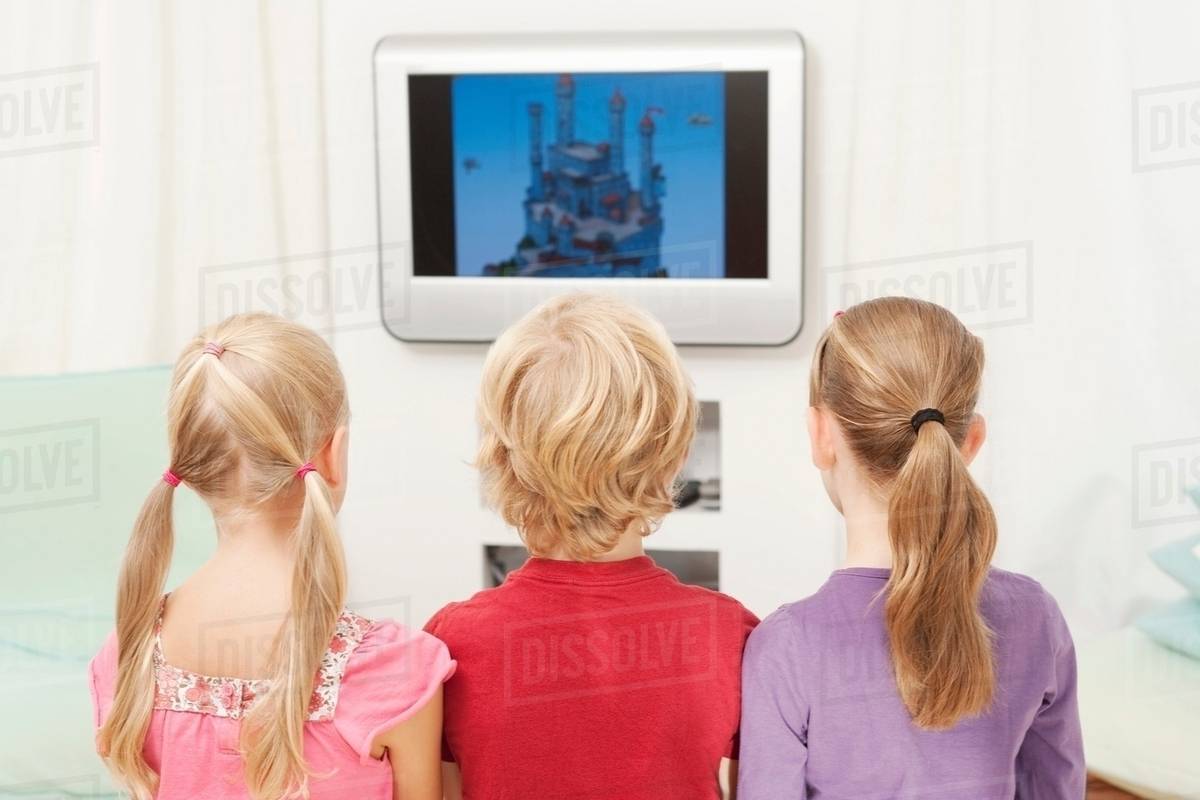 Children watching television - Royalty-free Stock Photo | Dissolve